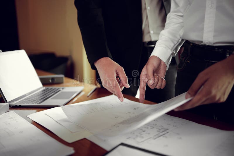 Two Engineers Pointing at Drawings Project, Architect Team Meeting ...