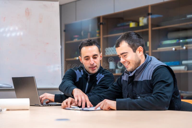 Two Engineers Talking Sitting in a Meeting Room Stock Image - Image of ...