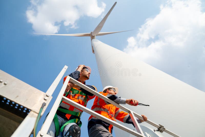 Two Engineers or Technician Workers Stand on Base of Big Windmill or ...