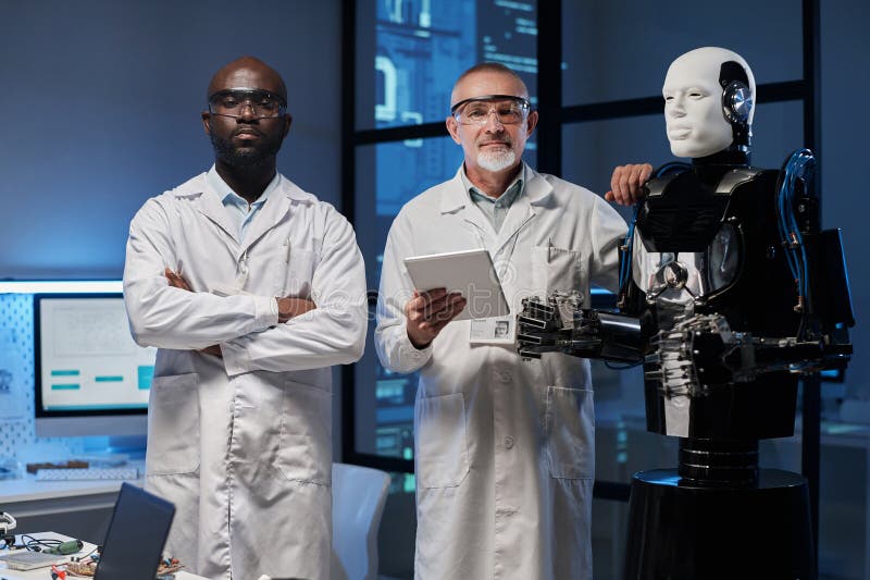 Two Engineers in White Coats Working in the Lab Stock Photo - Image of ...