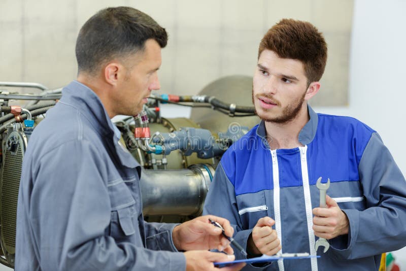 Two Engineers Working on Engine Stock Photo - Image of mechanics ...