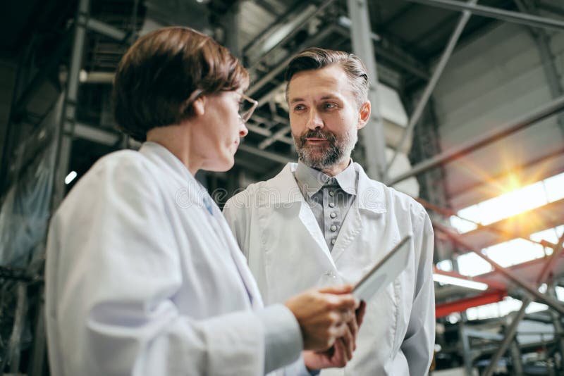 Two Engineers Working at the Factory Warehouse Stock Image - Image of ...