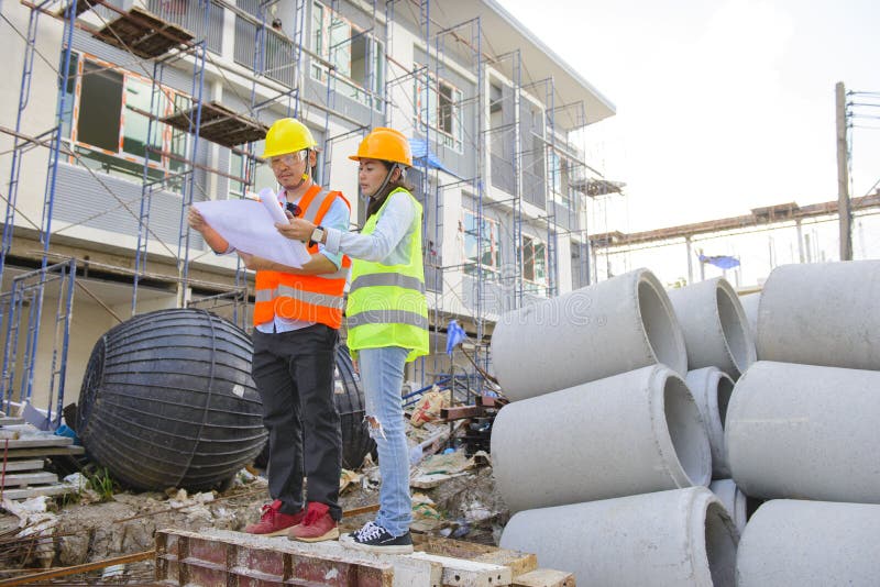 Two Engineers Working Together at Construction Site Stock Image - Image ...
