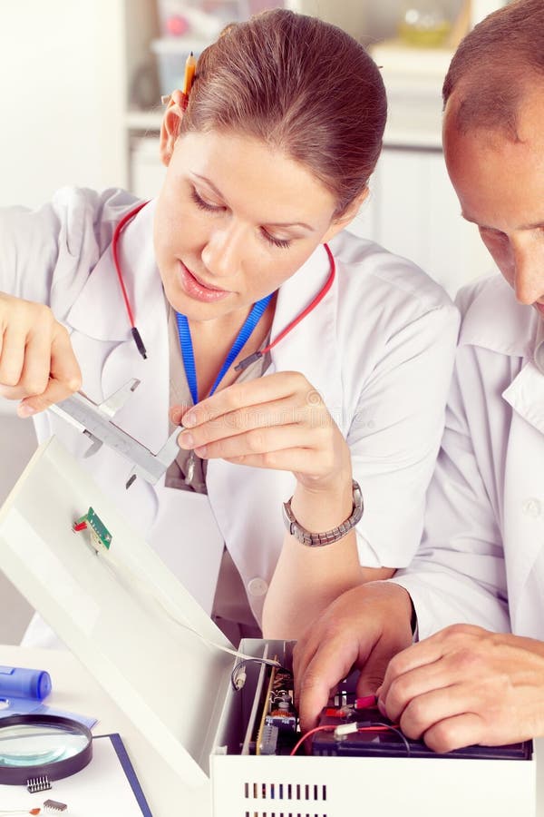 Two engineers stock image. Image of work, closeup, computer - 77353979