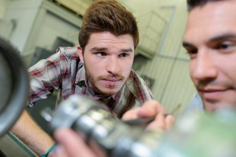 Two Engineers Working in Workshop Stock Photo - Image of talking ...