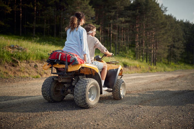 Two Enthusiastic Friends Driving Quad Together Stock Image - Image of ...