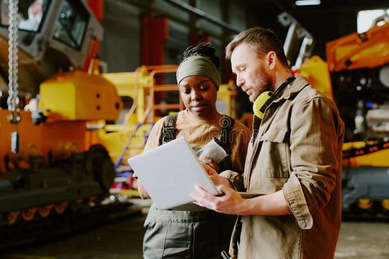 Two Technicians Discussing Issues at Work Stock Image - Image of ...