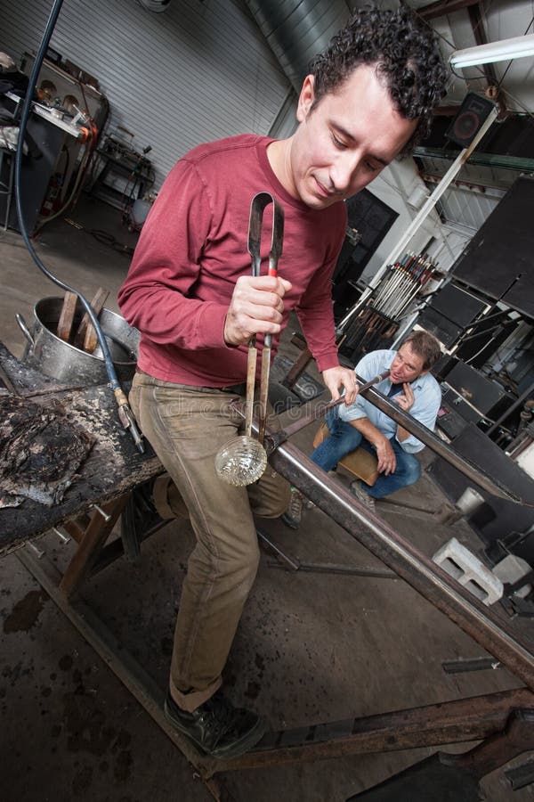Two Men Working on Glass Art Stock Photo - Image of studio, blowpipe ...