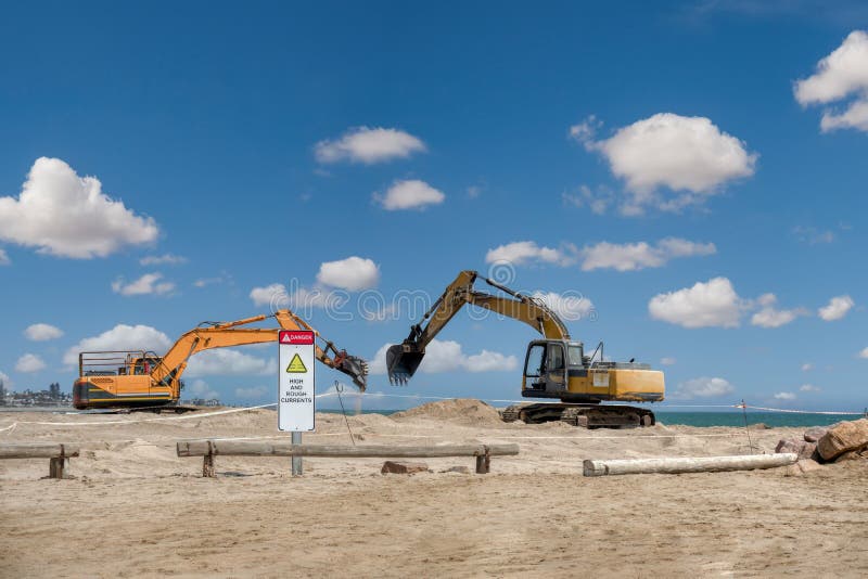 Two excavators digging stock image. Image of load, beach - 269350101