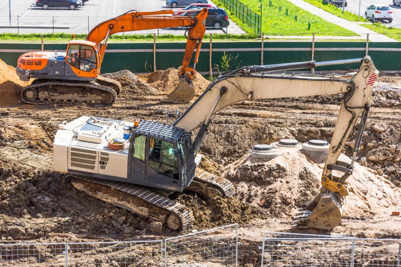 Two Excavators on Excavated Soil during the Construction of a Road in ...