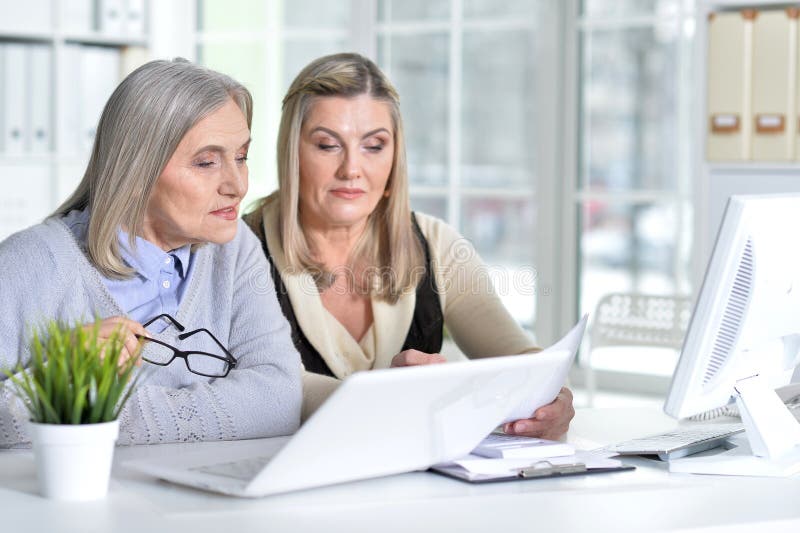 Two Excited Mature Women Working in Office Stock Photo - Image of ...