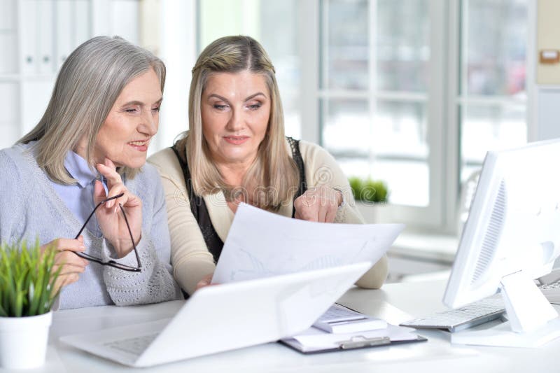 Two Excited Mature Women Working in Office Stock Photo - Image of ...