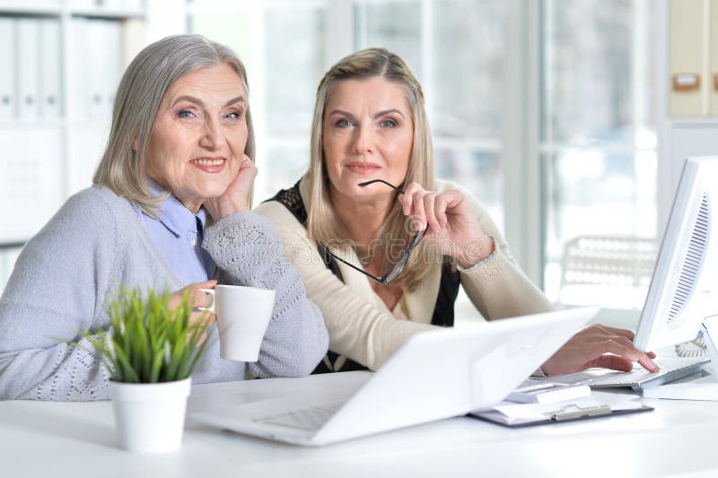 Two Excited Mature Women Working in Office Stock Image - Image of ...