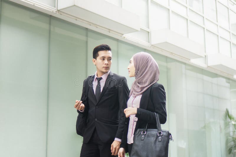 Two Executive at the Office Building Talking To Each Other Stock Image ...