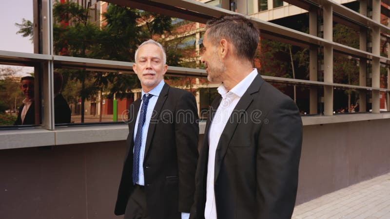 Two Executives Walking and Discussing Business Outside Stock Footage ...