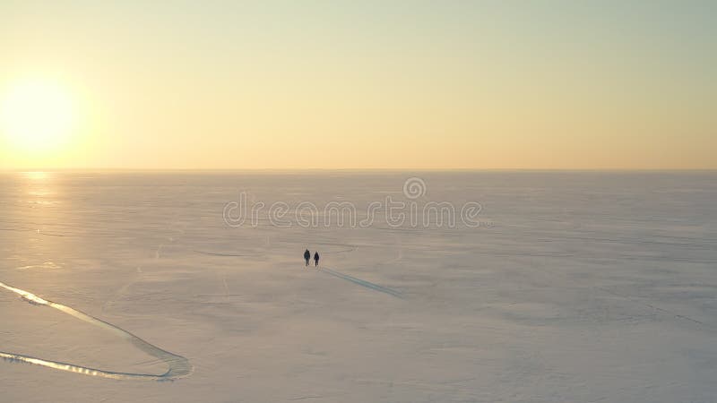 The Two Explorers Going Trough the Snow Field. Stock Image - Image of ...