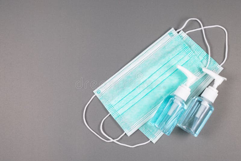 Two Face Masks and Alcohol stock image. Image of hygienic - 196692295