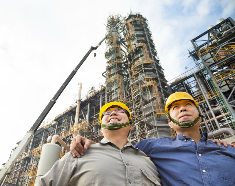 Two Factory Workers Discussion and Pointing for in Stock Photo - Image ...