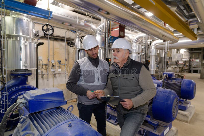 Two Factory Workers in Workshop Stock Image - Image of workshop ...