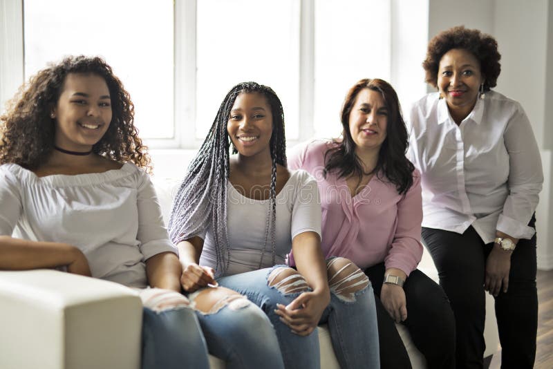 Two Family Friends Sitting on Sofa Together Stock Photo - Image of ...