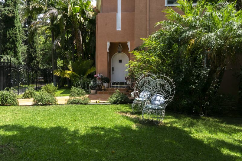 Two Fancy Empty Chairs on a Lawn in the Backyard on a Sunny Day Stock ...