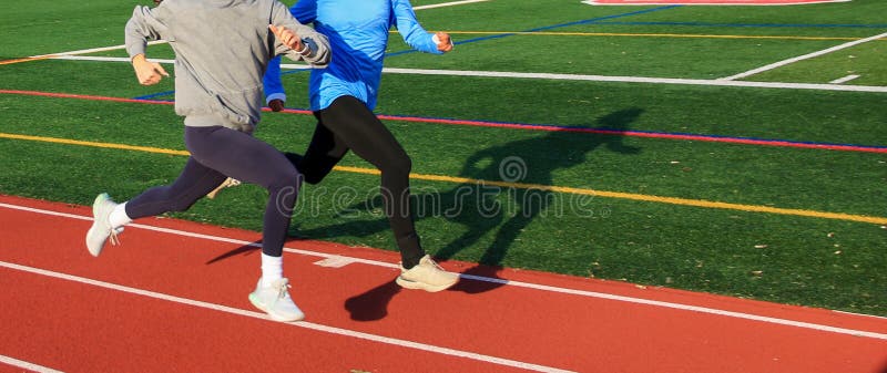 Two Fast Runners Training Together on a Track Stock Image - Image of ...
