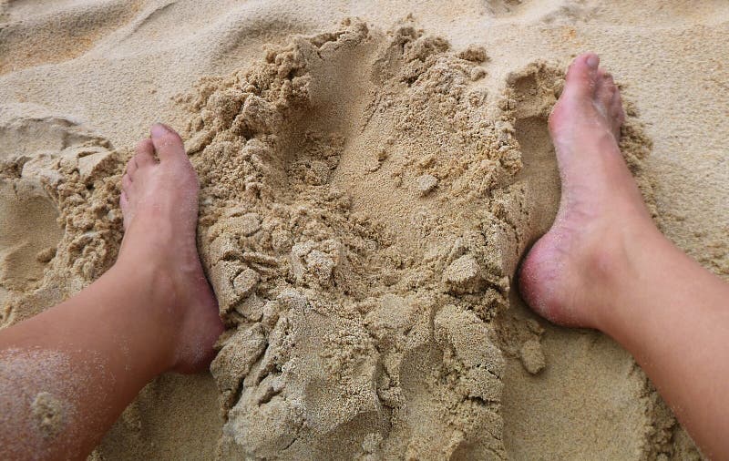 Two Feet Around Hole in the Beach Sand Stock Image - Image of colours ...