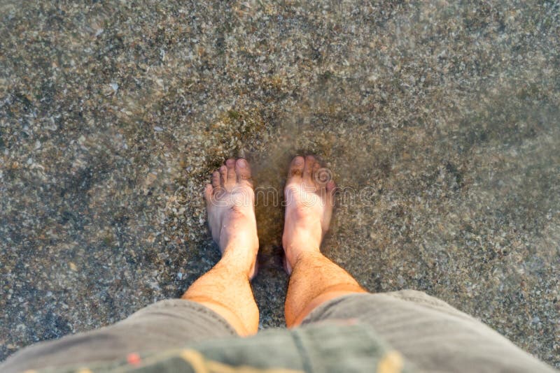 Two feet dipping stock photo. Image of flops, feet, nature - 97435286