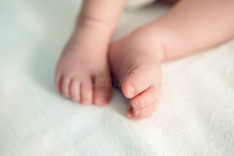 Two Feet of a Newborn Lying Stock Photo - Image of barefoot, babies ...