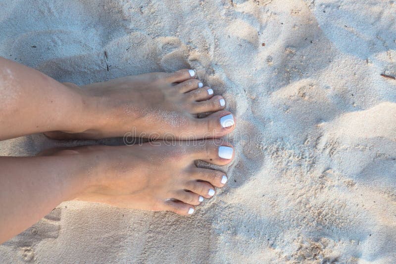 Two Female Bare Feet on White Sand Stock Image - Image of contrast ...
