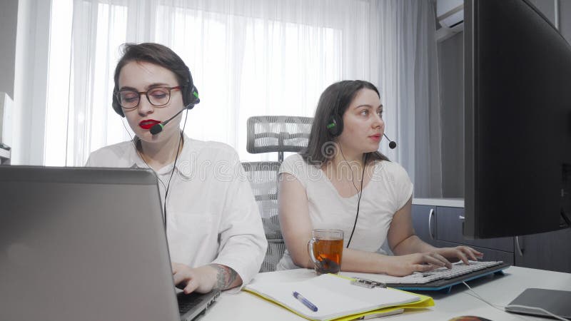 Two Female Call Center Agents Working on Their Computers Stock Image ...