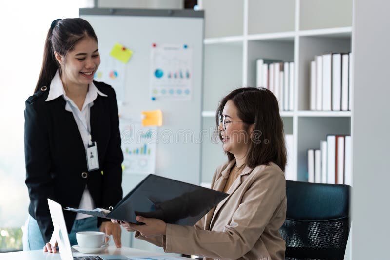 Professional Business Meeting in Modern Office Setting with Two Female ...