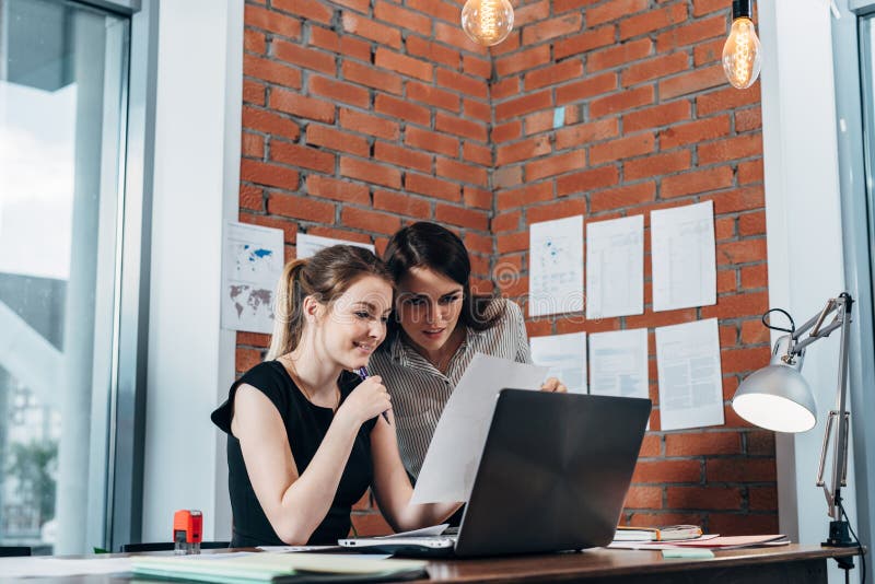 Two Female Colleagues in Office Working Together. Stock Image - Image ...
