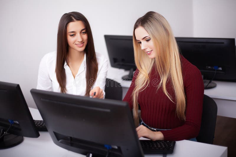 Two Female Colleagues in Office Working Together Stock Image - Image of ...