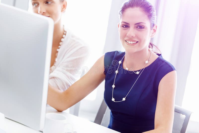 Two Female Colleagues in Office Stock Image - Image of desk, occupation ...
