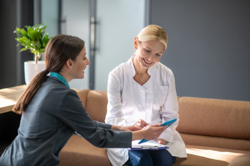 Two Female Colleagues Spending Time Together at Work Stock Photo ...