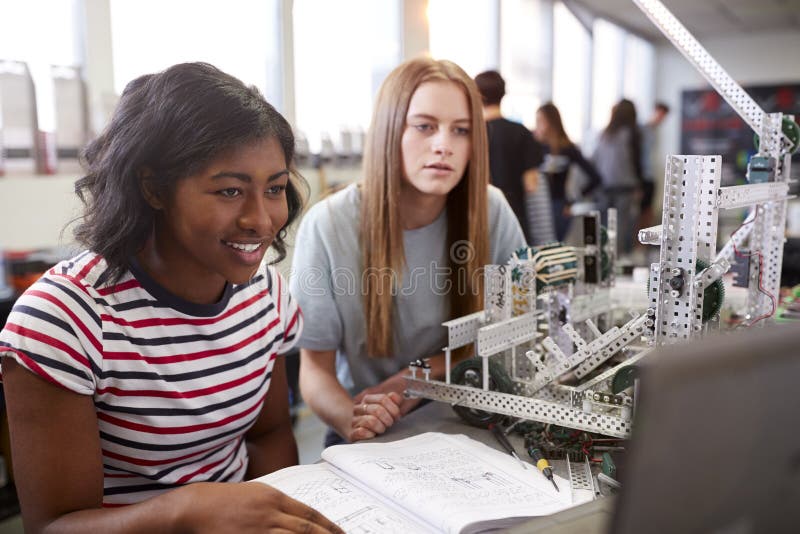 Two Female College Students Building Machine in Science Robotics or ...