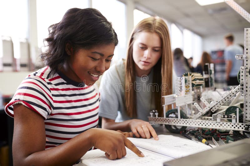 Two Female College Students Building Machine in Science Robotics or ...