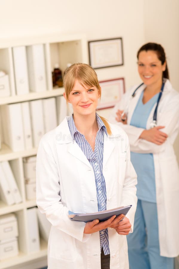 Two Female Doctor Standing at Medical Office Stock Photo - Image of ...
