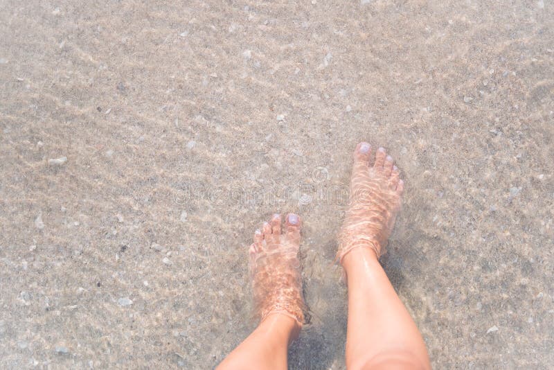Two Female Feet Stay in the Sea, Stone, Wave Stock Photo - Image of ...