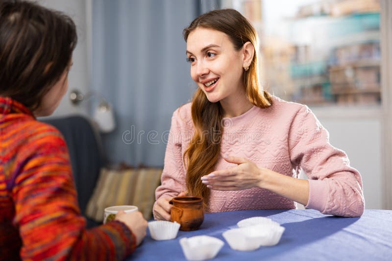 Two Female Friends Drinking Tea and Talking at Home Stock Photo - Image ...