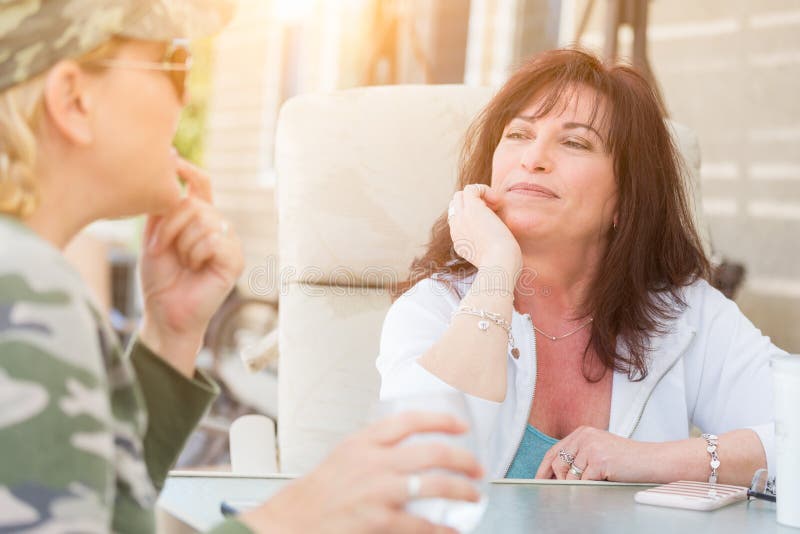 Two Female Friends Enjoying Conversation Outside Stock Photo - Image of ...