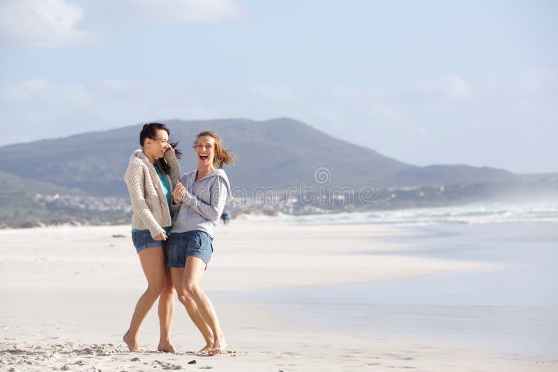 Two Female Friends Laughing at the Beach Stock Photo - Image of beach ...