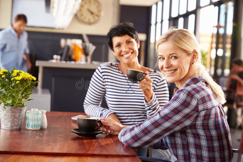 Two Female Friends Talking at a Coffee Shop Stock Image - Image of ...