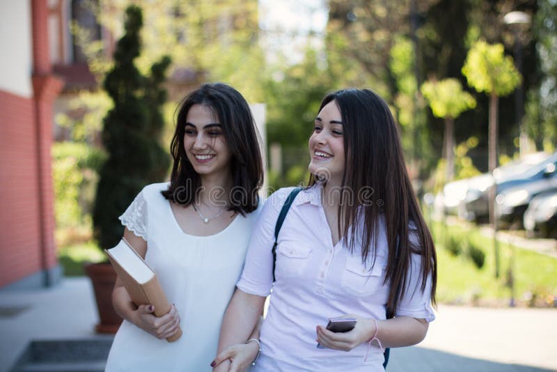 Two Female Friends Walking Around the University Campus Stock Image ...