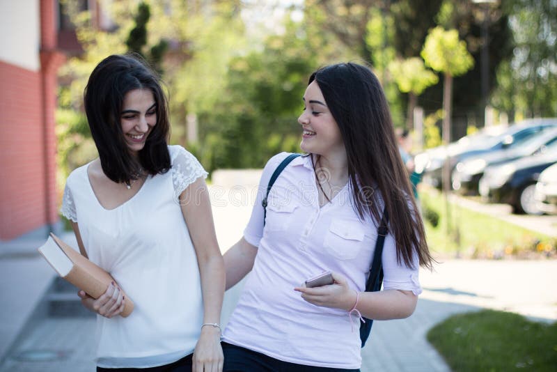 Two Female Friends Walking Around the University Campus Stock Image ...