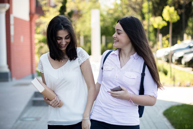Two Female Friends Walking Around the University Campus Stock Image ...
