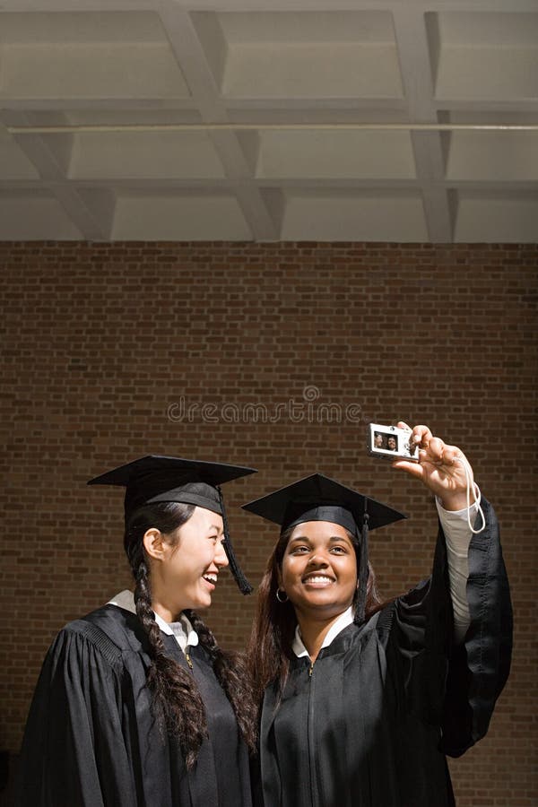Two Female Graduates Taking a Photograph Stock Photo - Image of digital ...