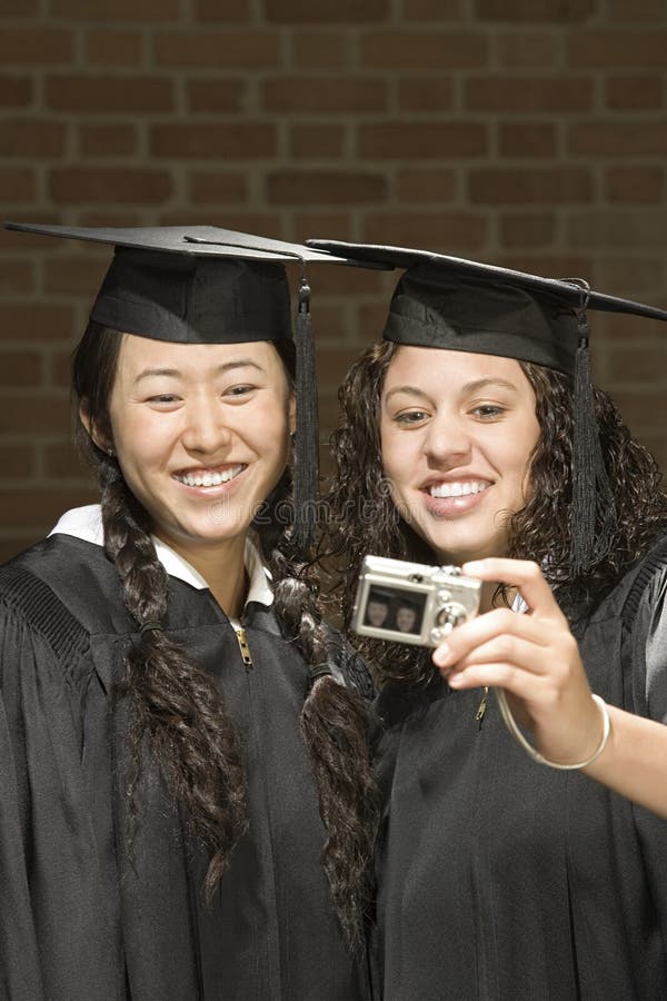 Two Female Graduates Taking a Photograph Stock Photo - Image of formal ...