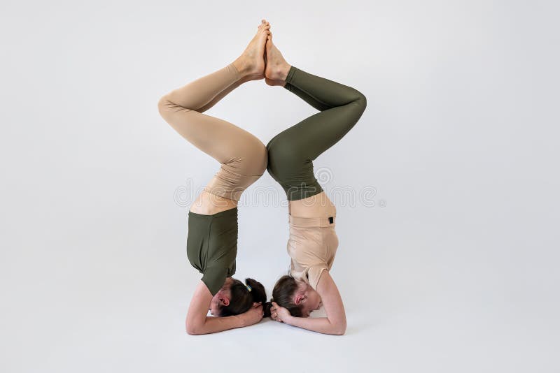 Two Female Instructors Show How To Properly Perform Yoga or Stretching ...